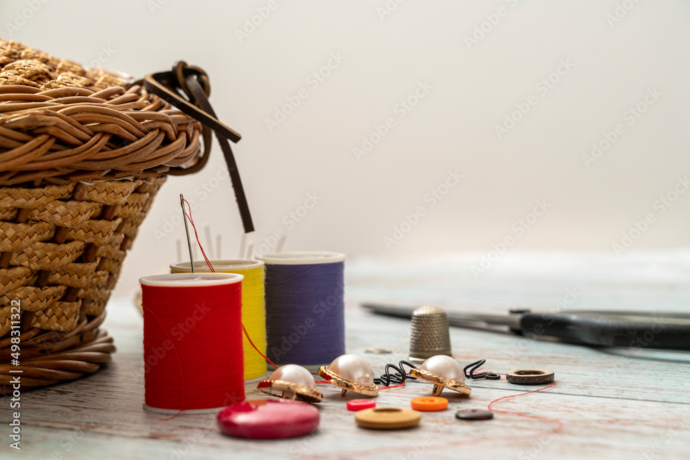 front view of objects for sewing and pattern making such as a spool of ...