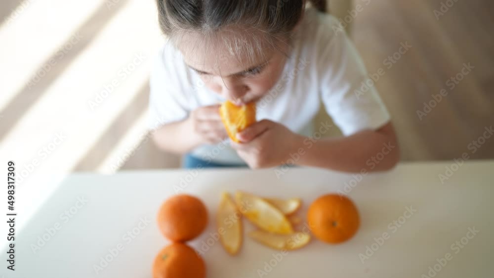 girl child eating oranges. happy family fruit healthy food kid concept ...