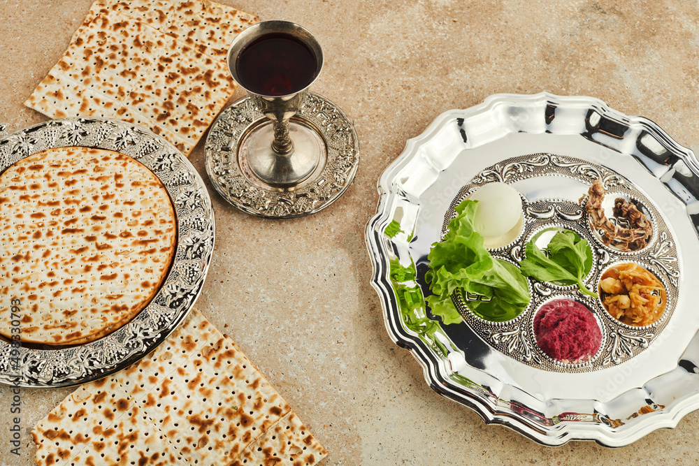 Passover Seder plate with traditional food ontravertine stone ...