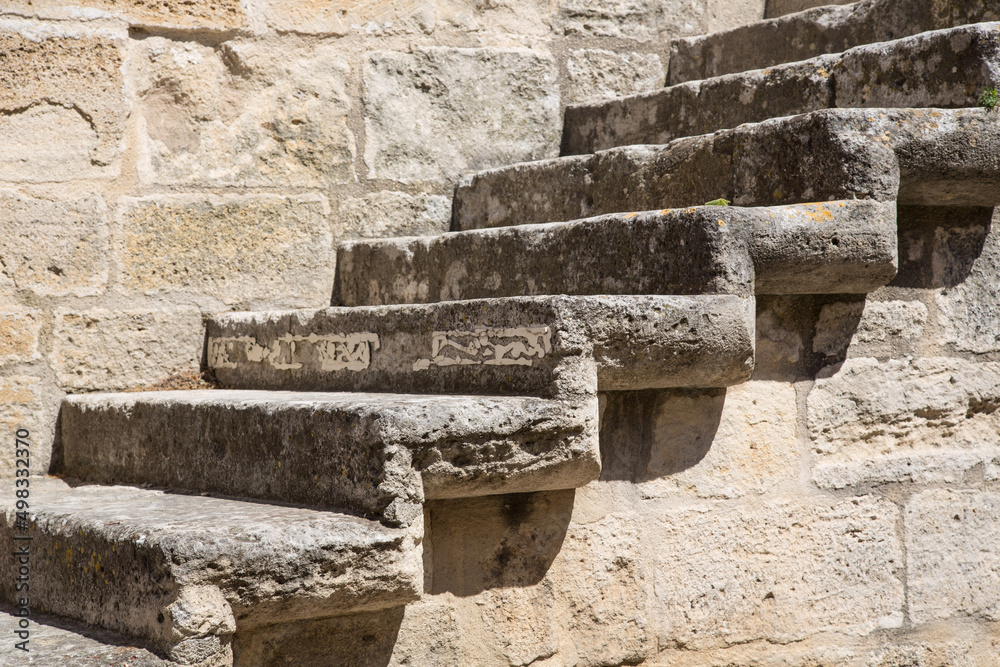Detail of a stone stairway leading up to the city wall of the fortified ...