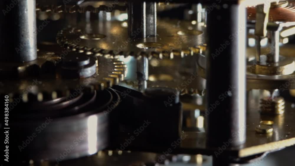 Macro video of the primitive clockwork mechanism of an old desktop ...