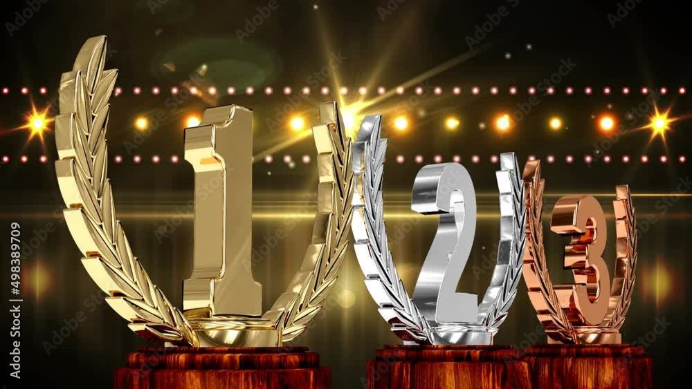 Animation of first, second and third place award trophies at floodlit ...