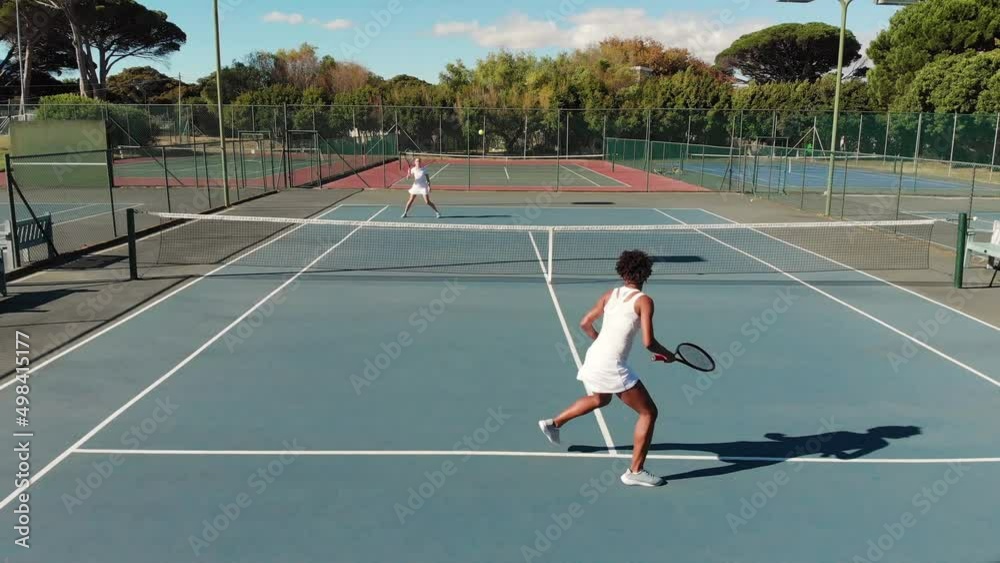 Video of top view of diverse female tennis players on court during ...