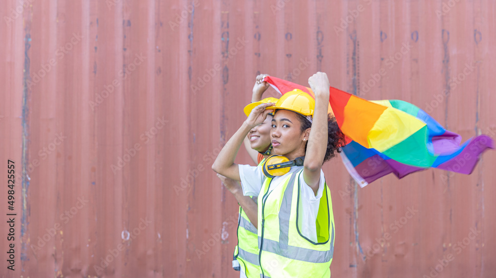 Young female African sisters in safety uniform and helmet show LGBT ...