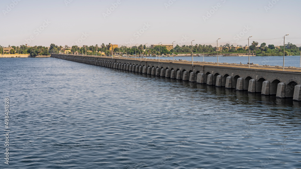 The dam of the sluice system on the Nile in Esna. A long concrete ...