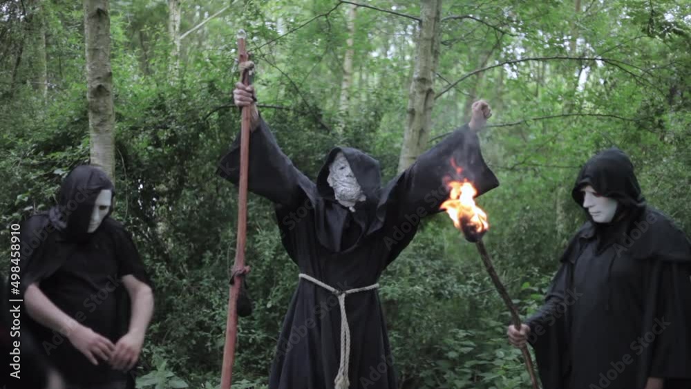 A cult meets in the woods to perform a ritual chant and the grand ...
