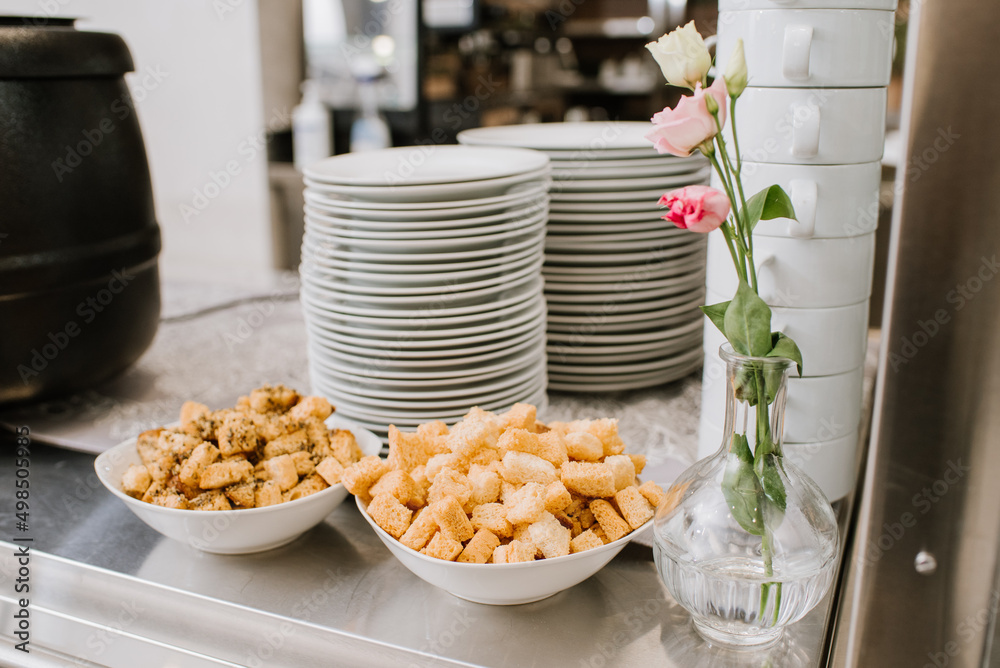 Different types of dishes in containers on the buffet table in the ...
