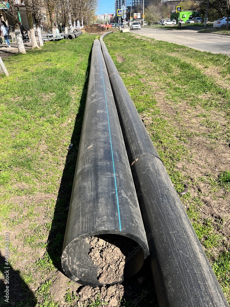Pre-insulated pipe laying. Water supply pipe and sewer pipe on ...