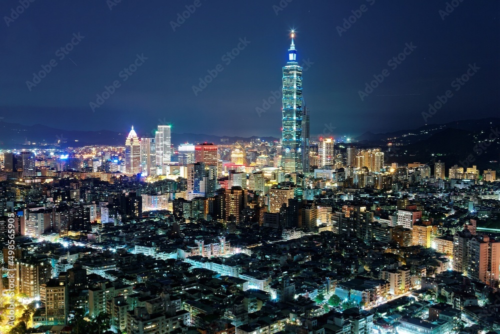 Aerial panorama over Taipei after dark, the capital city of Taiwan ...