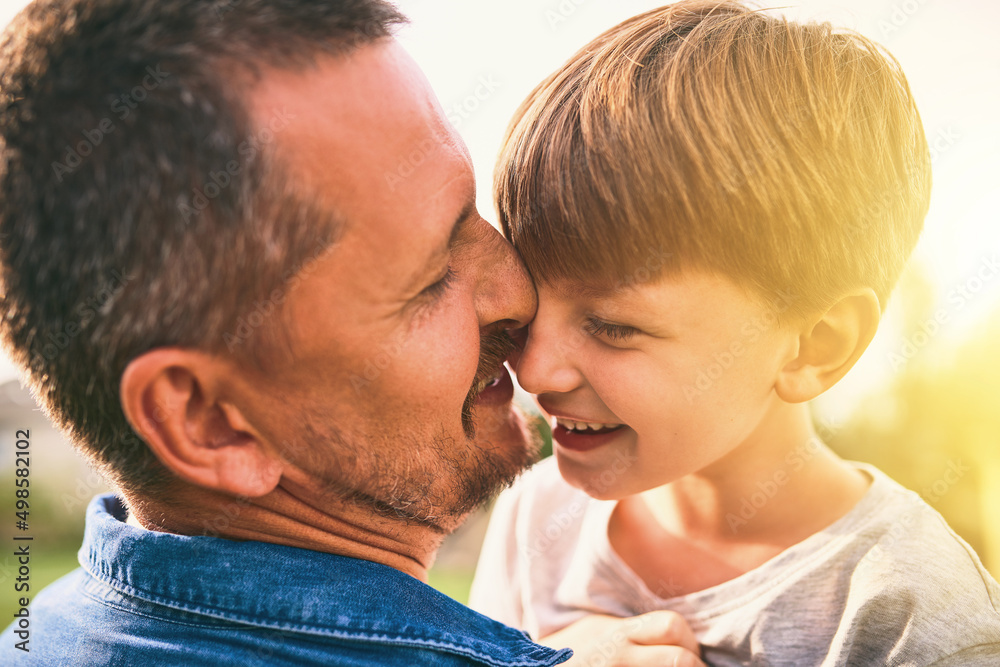 Aspiring to be a hero to his son. Shot of a father bonding with his ...