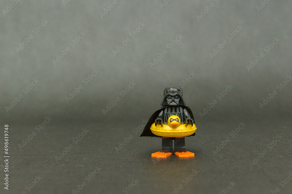 Minifigure of Darth Vader on vacation wearing a duck float and fins ...