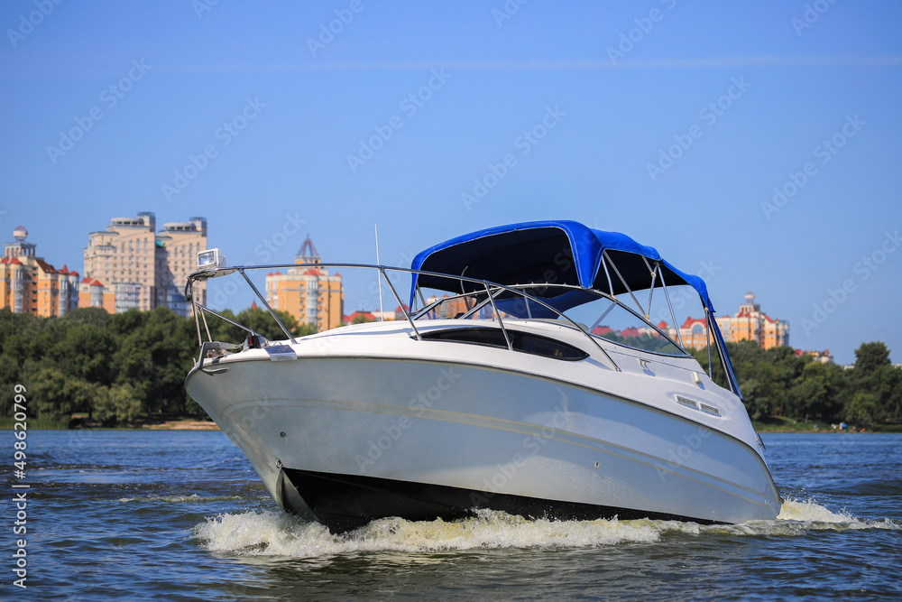 White motorboat floating on the river Stock Photo | Adobe Stock