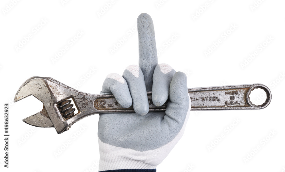 The worker's hand holds an adjustable wrench in his hand and shows the ...