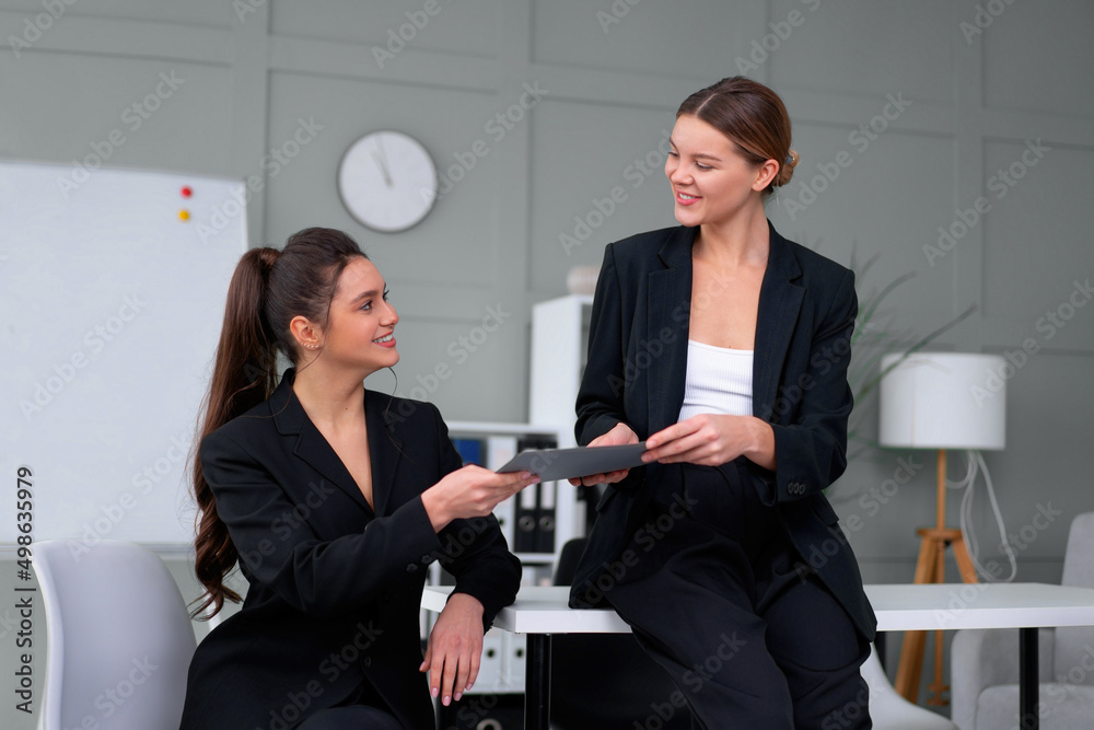 Young women leaders are checking financial statements from paper ...