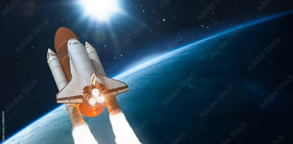 Space shuttle on orbit of Earth planet. View from outer space ...