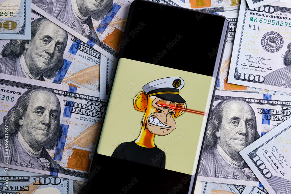 BORED APE 3749 NFT digital art seen on smartphone and dollar banknotes ...