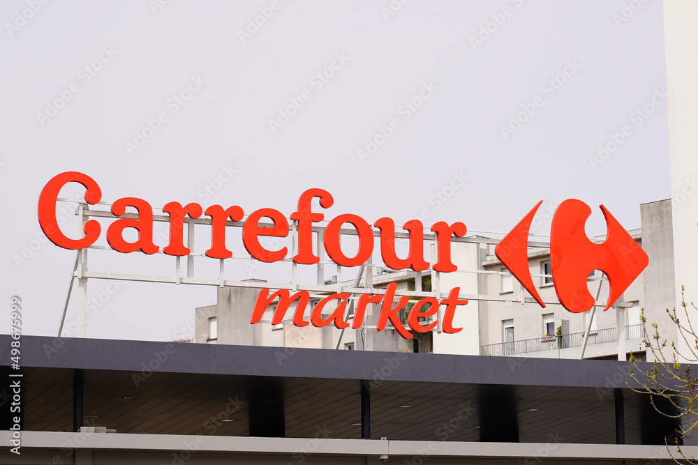 carrefour market store brand sign and text logo on roof facade ...