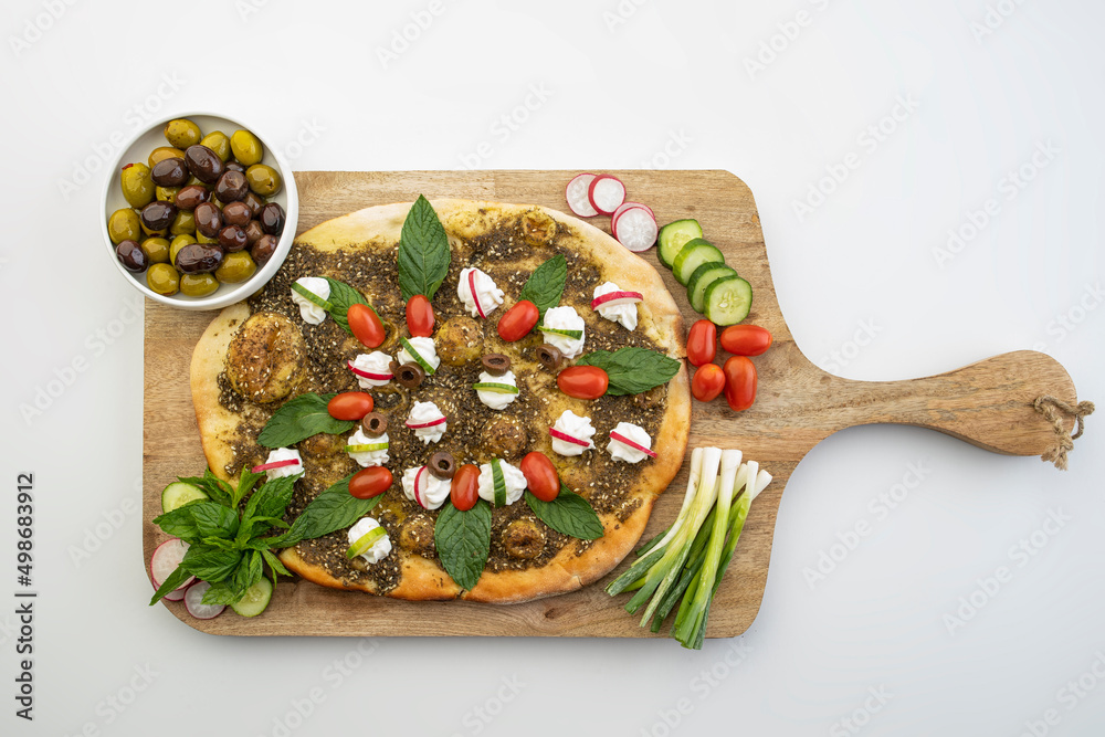 lebanese Manoushe ,bread of thyme topped with mint, reddish, and Labneh ...