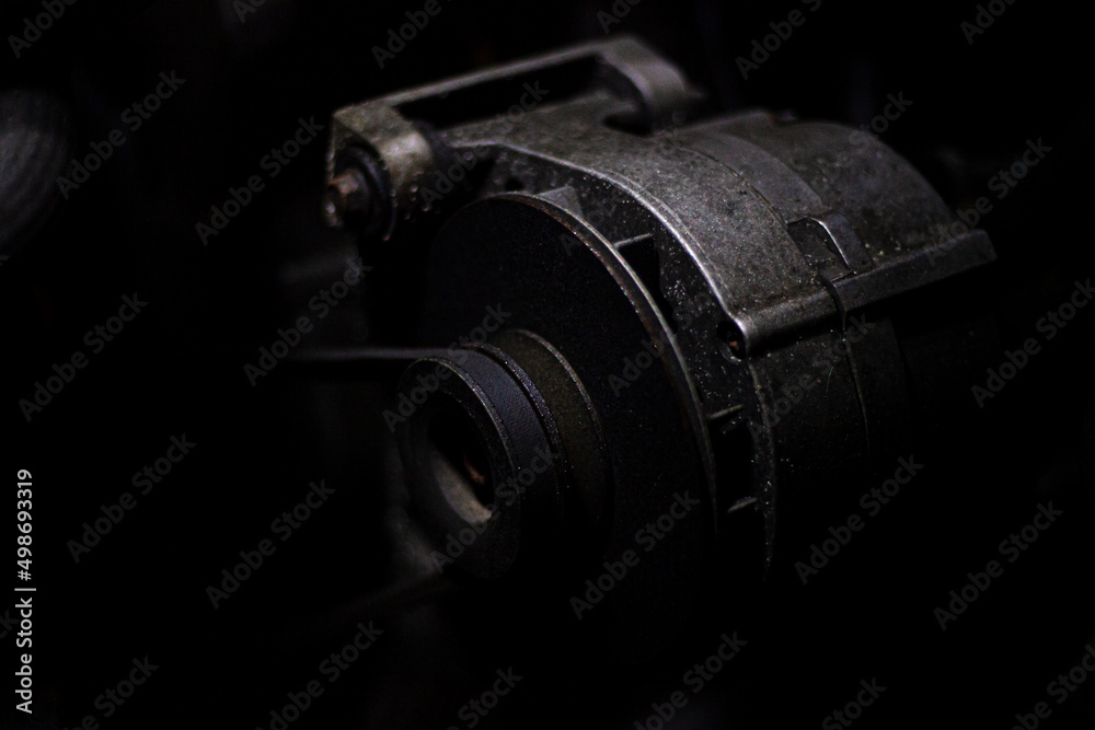 Machine engine in a dark workshop. Automotive parts. The device of ...