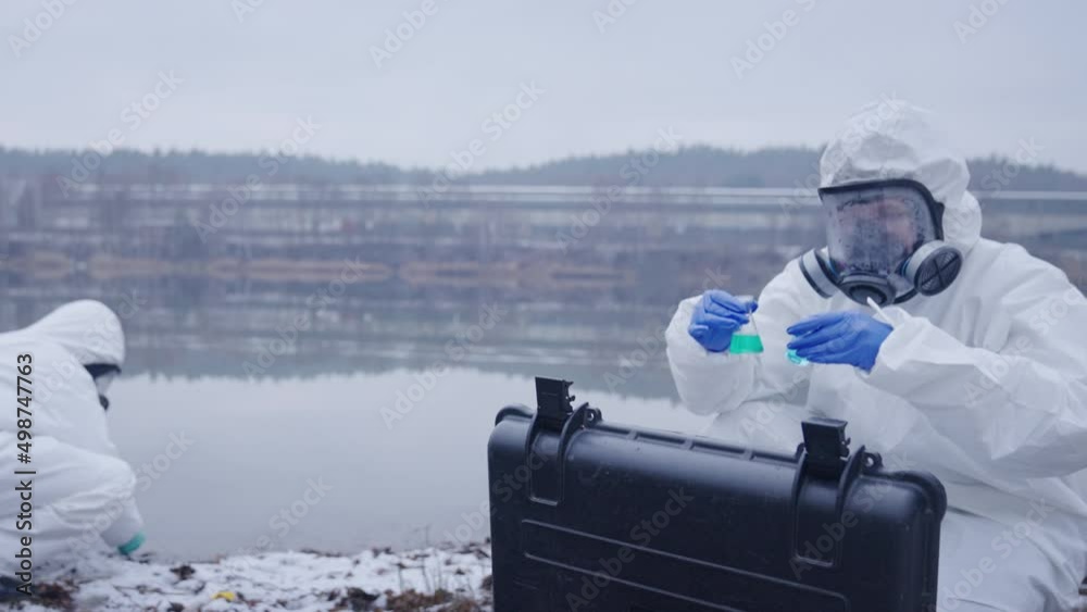 Diverse team of scientists picking biohazardous samples in the infected ...