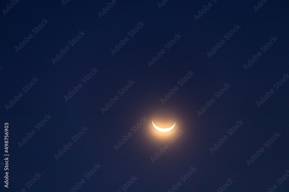 Crescent moon on blue sky. Look like a smile on a good day. Stock Photo ...