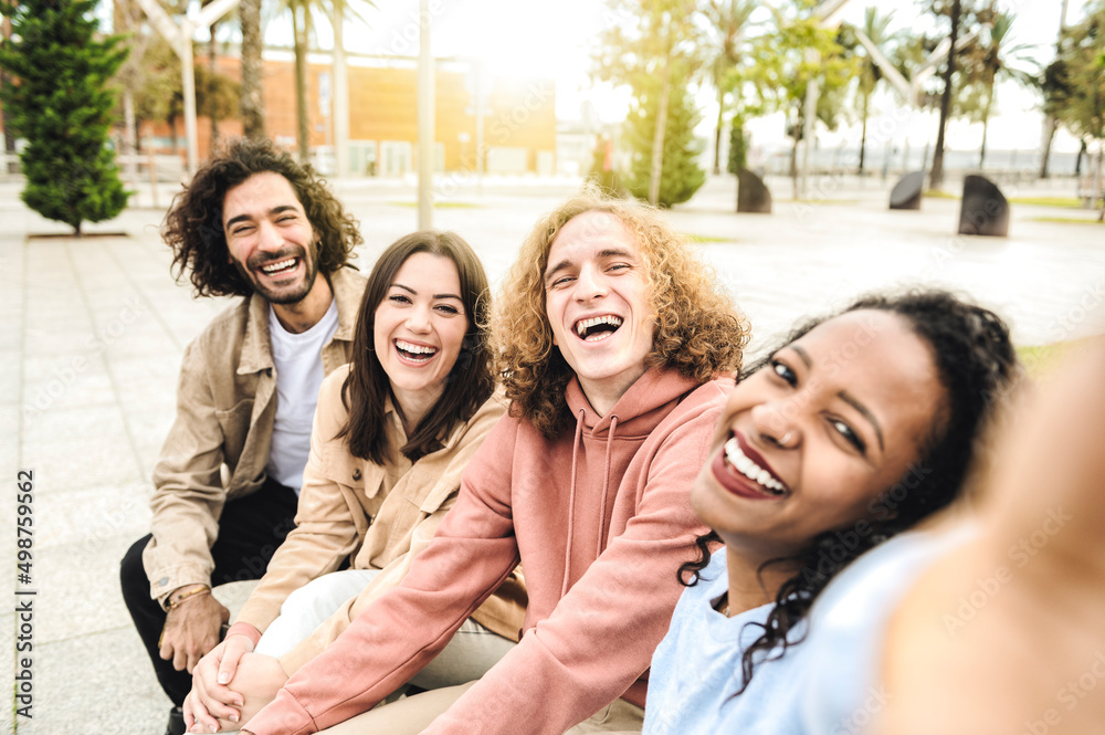 Multiracial group of smiling friends make selfie photo with smartphone ...