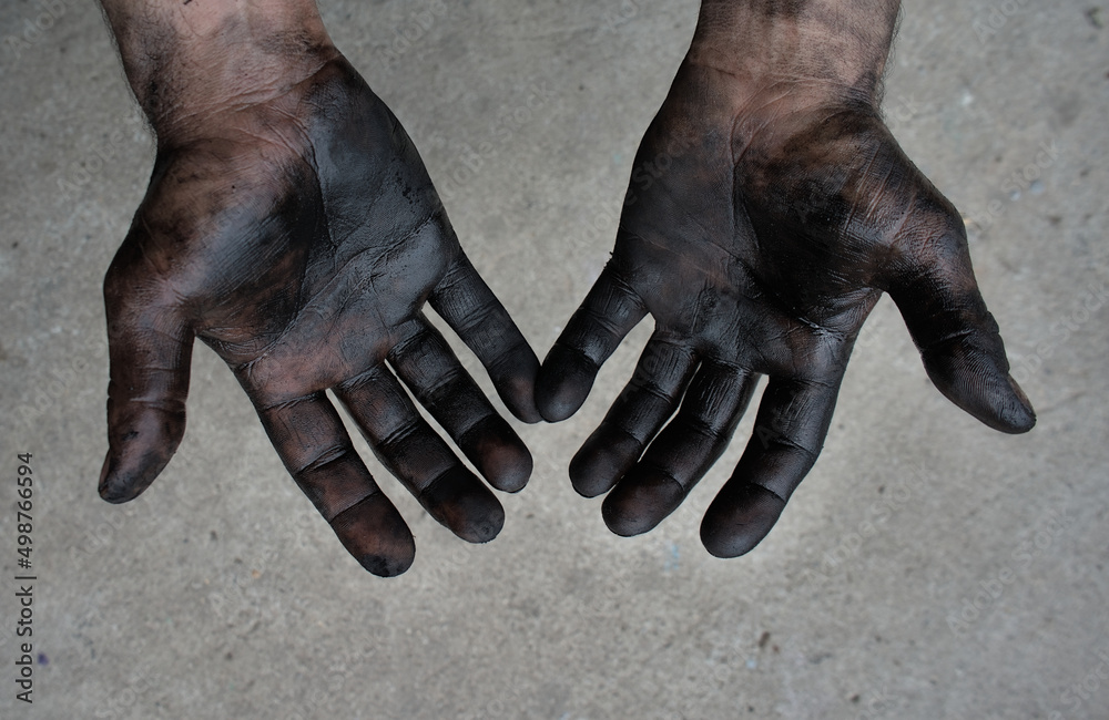 male worker hands in black oil on a gray background Stock Photo | Adobe ...
