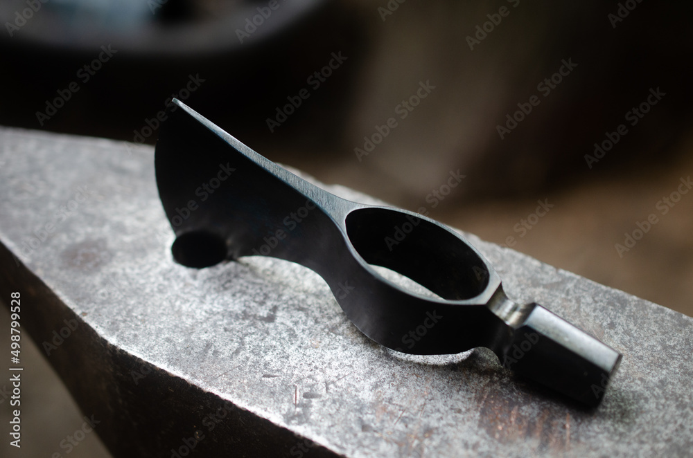 tomahawk axe on anvil Stock Photo | Adobe Stock