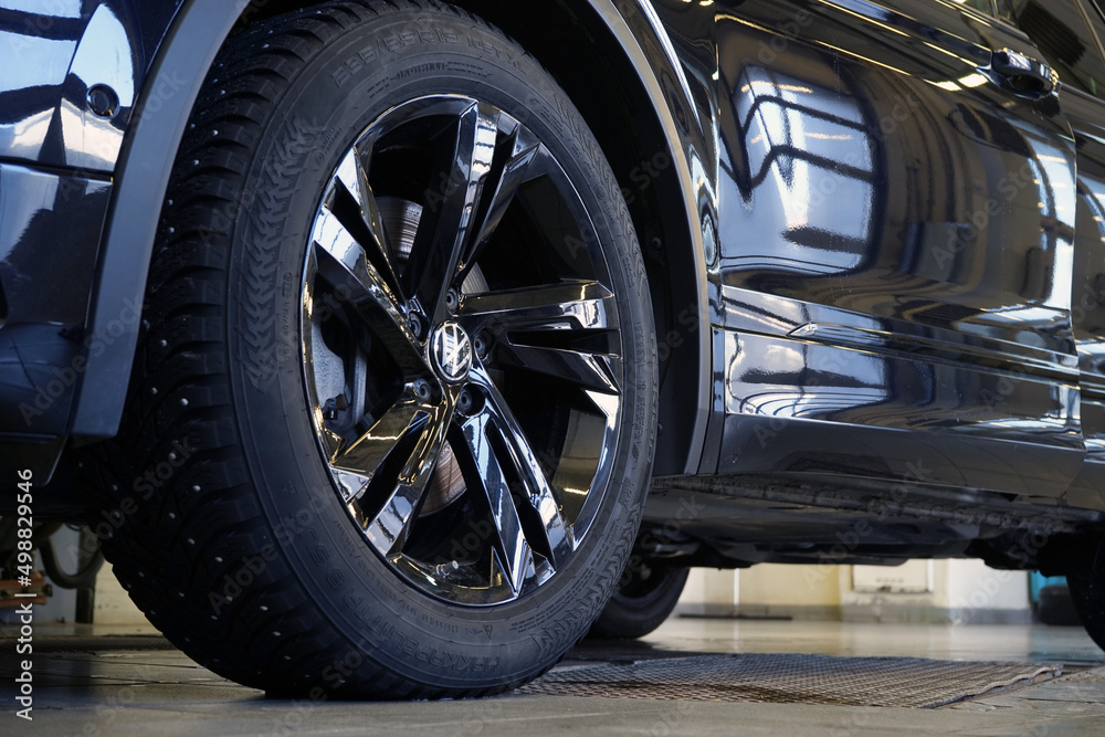 Moscow Russia - April 2022: Black alloy wheel with tire mounted on a ...