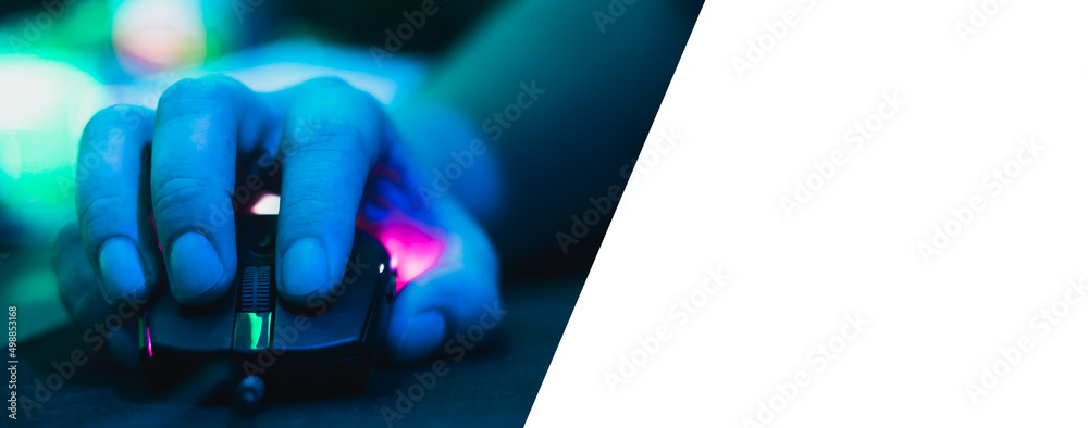 professional video gamer, playing with his mouse with rgb neon lights ...