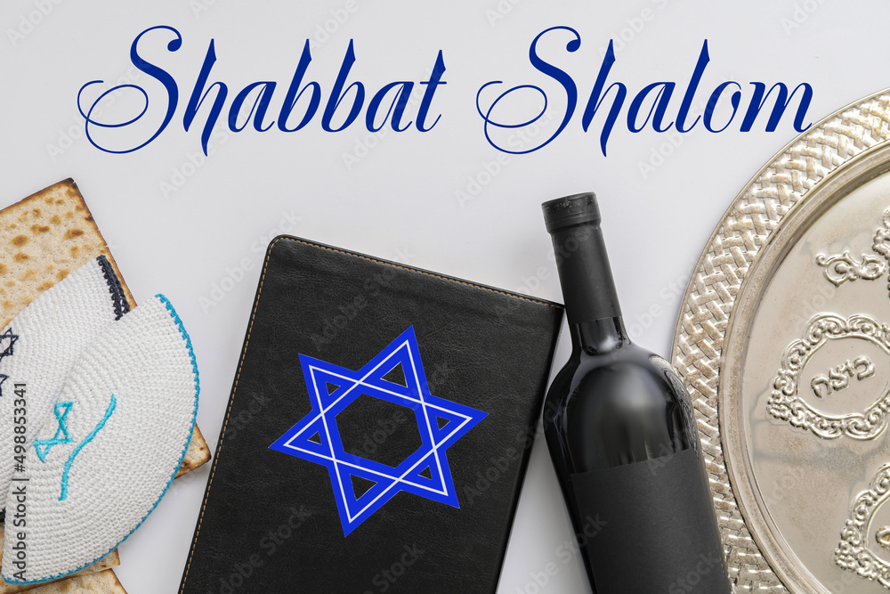 Torah, wine, Jewish cap, matza and text SHABBAT SHALOM on white ...