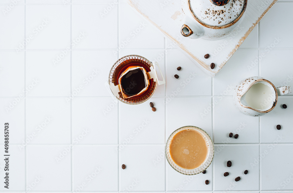 Ground drip coffee using paper type filter with coffee beans on white ...