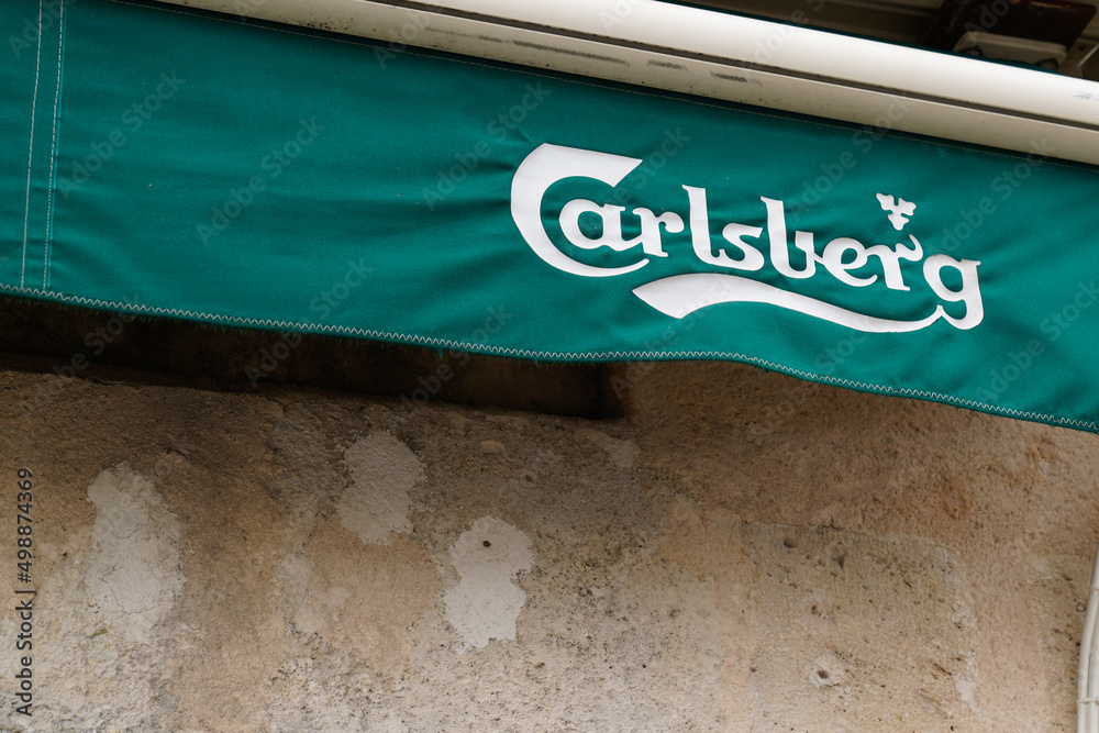 carlsberg beer sign text and brand logo on flag facade bar pub ...