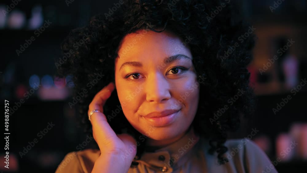 Woman with psychic powers smiling on camera, hypnotizing client ...