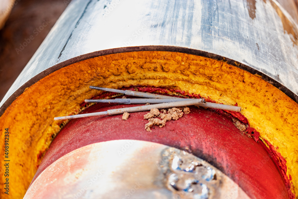 Insulated pipe. Large metal pipes with a plastic sheath laid in a ...