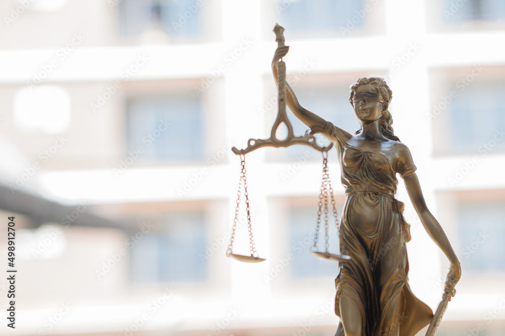 a female judge or the Roman goddess of justice, symbols of law on ...