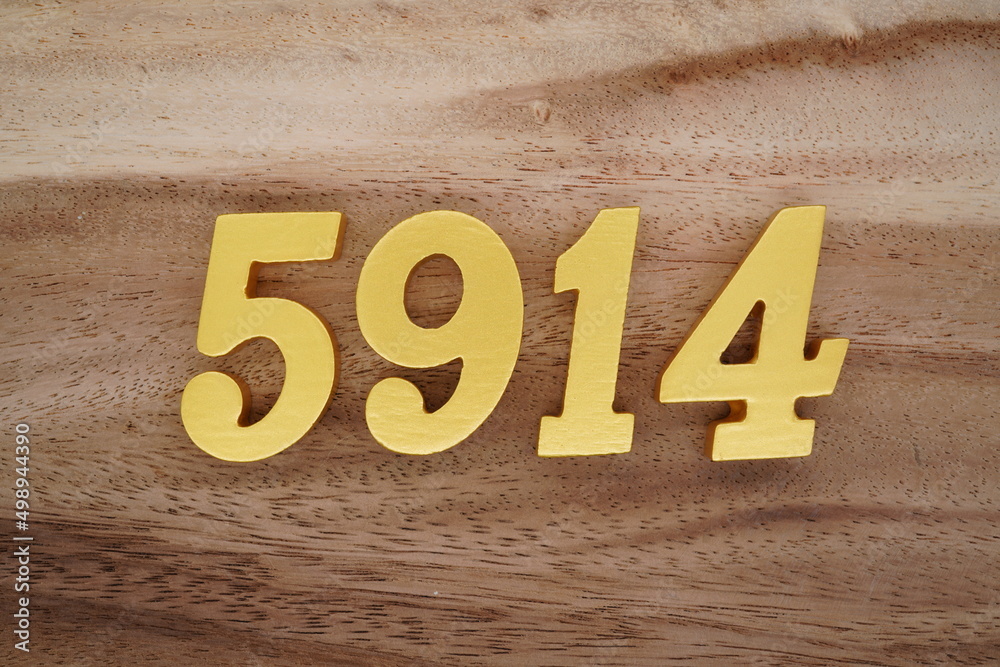 Golden Arabic numerals on a real brown and white wooden floor number ...
