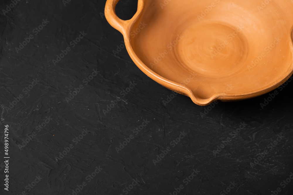 Clay pots for cooking. Pots of clay of a light colour. Baking dishes on ...