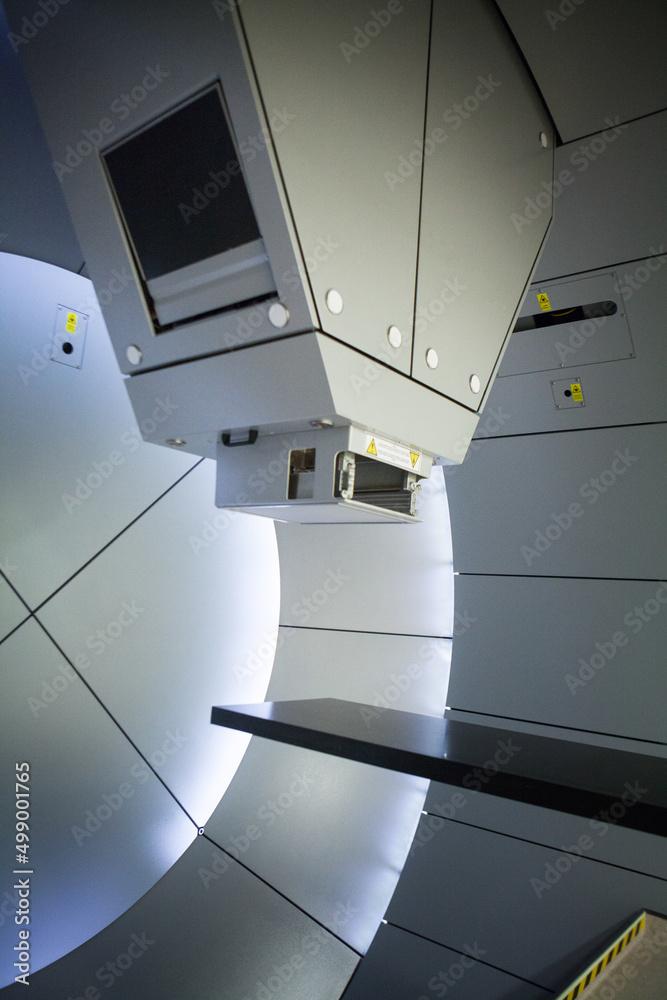 Proton therapy irradiates cancer cells with a beam of protons inside ...