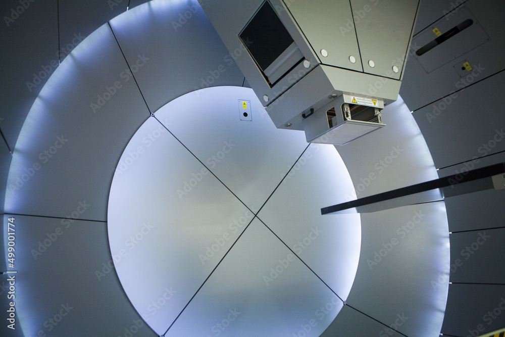 Proton therapy irradiates cancer cells with a beam of protons inside ...