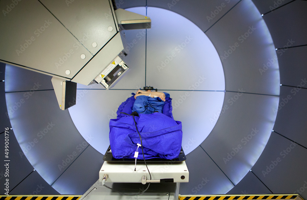 Proton therapy irradiates cancer cells with a beam of protons inside ...