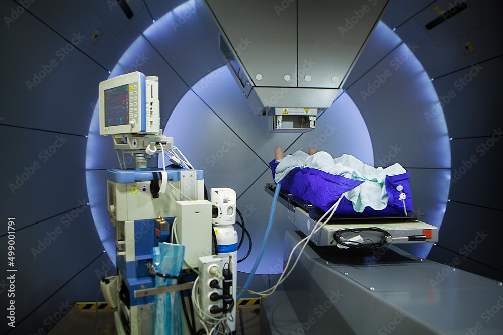 Proton therapy irradiates cancer cells with a beam of protons inside ...