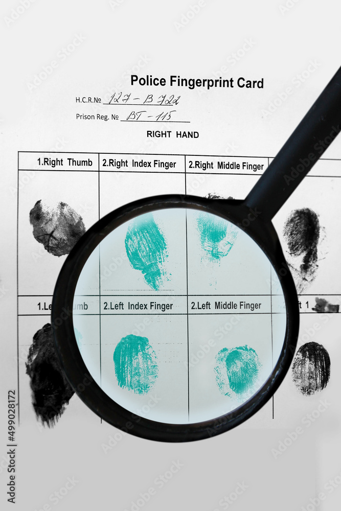 Forensic Specialist Detective Identifies Fingerprints At Crime Scene With A Magnifying Glass