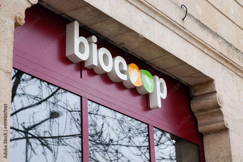 Biocoop logo sign and brand text on wall entrance facade bio store ...