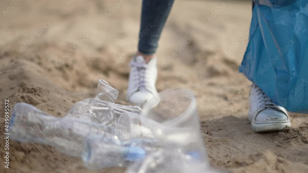 Teamwork family work. Children collect plastic garbage in bags. Kid ...