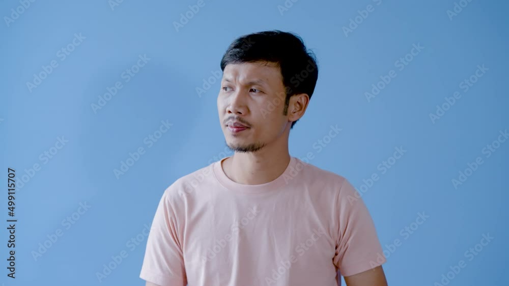 4K 50fps, Asian man mustache,Half of the young man looked down at his ...