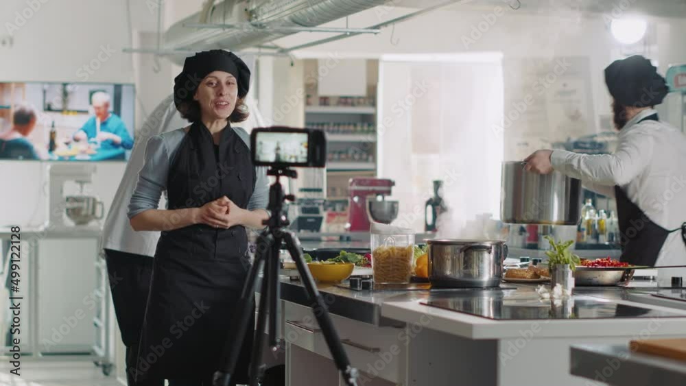 Female chef recording cooking show video on TV program, filming ...