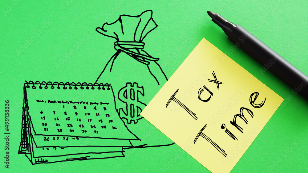 Foto de Tax time is shown on the photo using the text do Stock | Adobe ...
