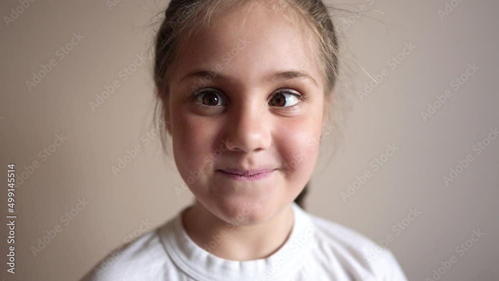 child girl playing funny a squinting eyes. strabismus squint happy ...