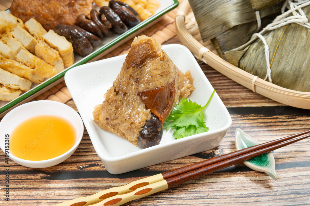 rice dumpling is a traditional Chinese rice dish made of glutinous rice ...